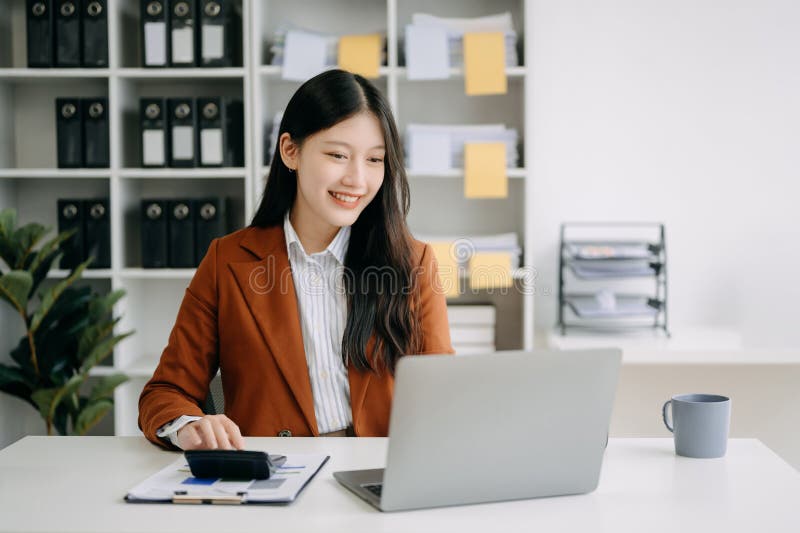 Asian Businesswoman Working in the Office with Working Notepad, Tablet ...