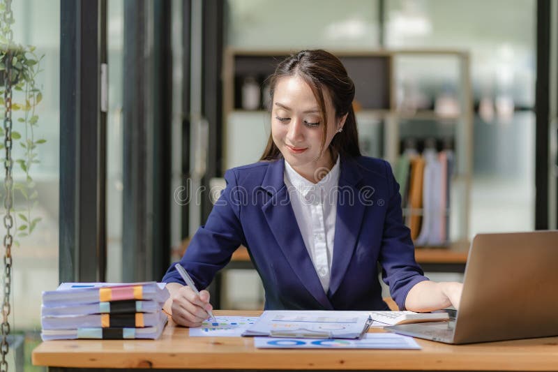Asian Businesswoman Working Using Laptop Computer Calculating Expenses ...