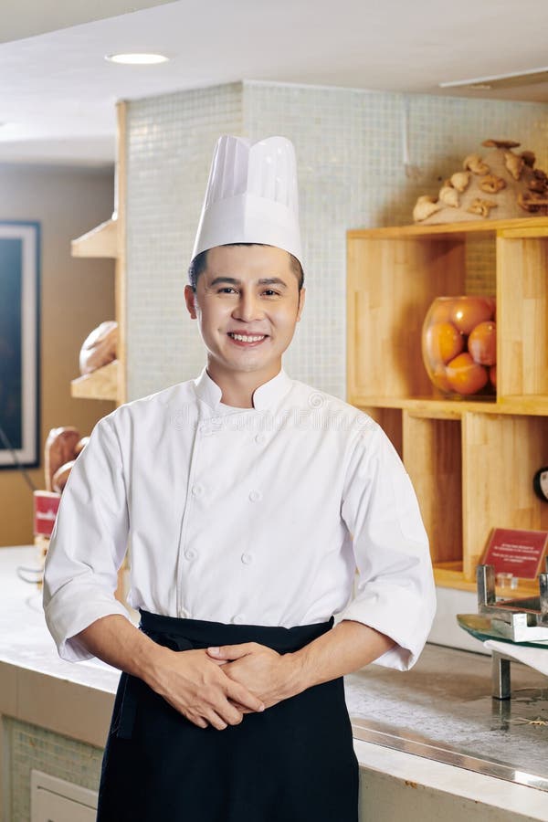 Asian chef in the kitchen stock image. Image of adult - 158741171