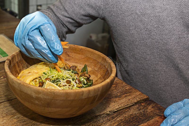 An Asian Chef Preparing a Bowl of Ramen that Still Lacks the Miso Soup ...