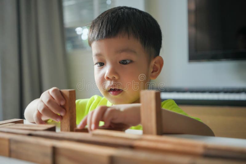 Asian Child Boy Playing with Wooden Blocks. Stock Photo - Image of ...