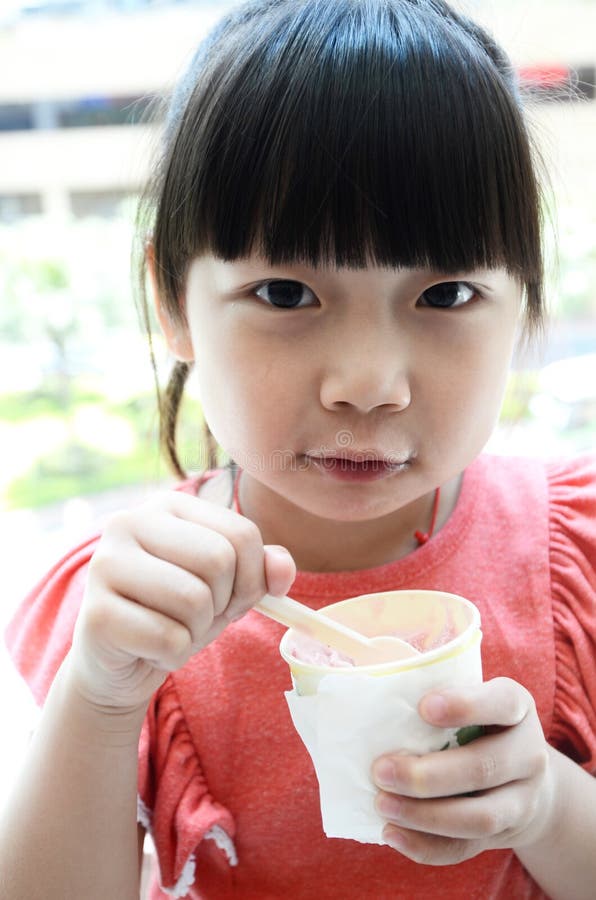 Asian Child Eating Ice Cream Stock Photo - Image of born, china: 19782434