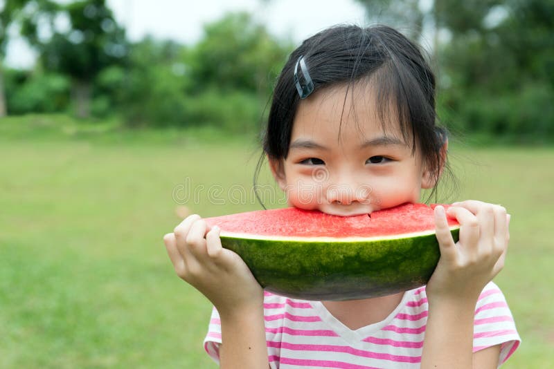 Asian Child Eating Watermelon Stock Photo - Image of spring, smiling ...