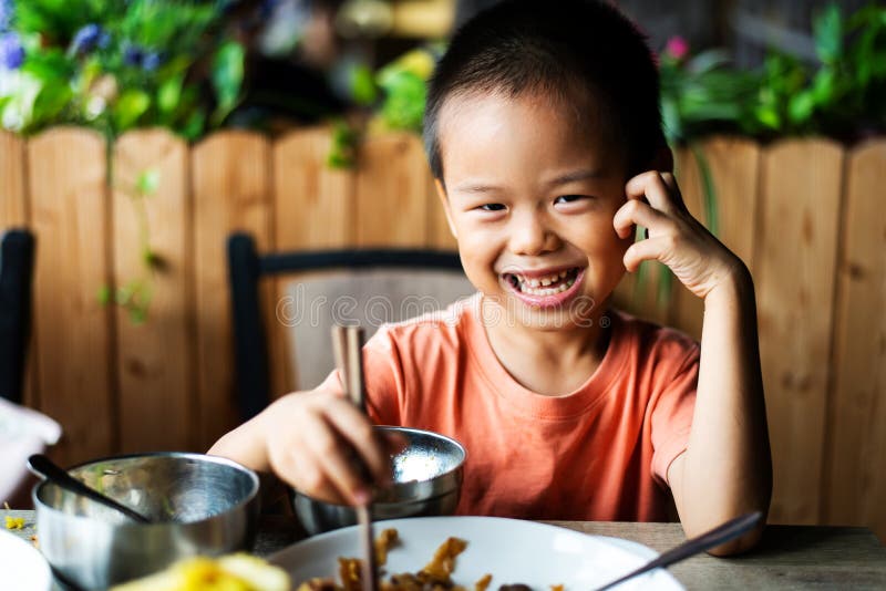 Asian Child Having Lunch at the Restaurant Stock Photo - Image of child ...
