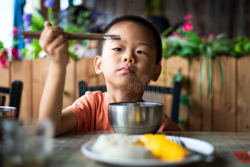 Asian Child Having Lunch at the Restaurant Stock Photo - Image of ...