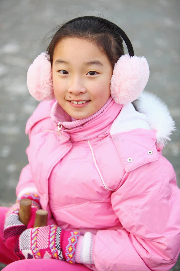 Asian child ice-skating stock image. Image of people - 12468265