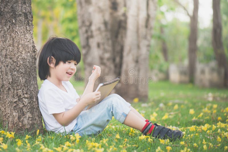 254 Boy Reading Book Under Tree Stock Photos - Free & Royalty-Free ...