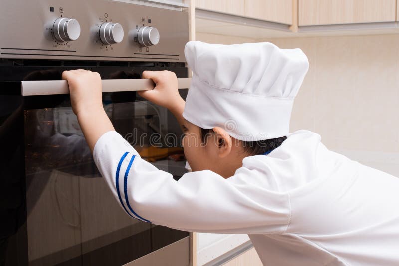 Asian Chinese Boy in White Chef Uniform Baking Cookies Stock Photo ...