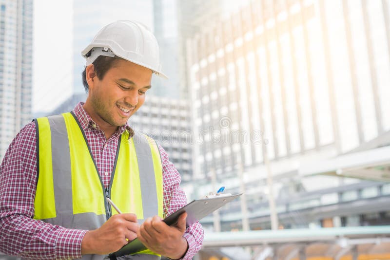 Asian Civil Engineer Working at Building Site. Stock Photo - Image of ...