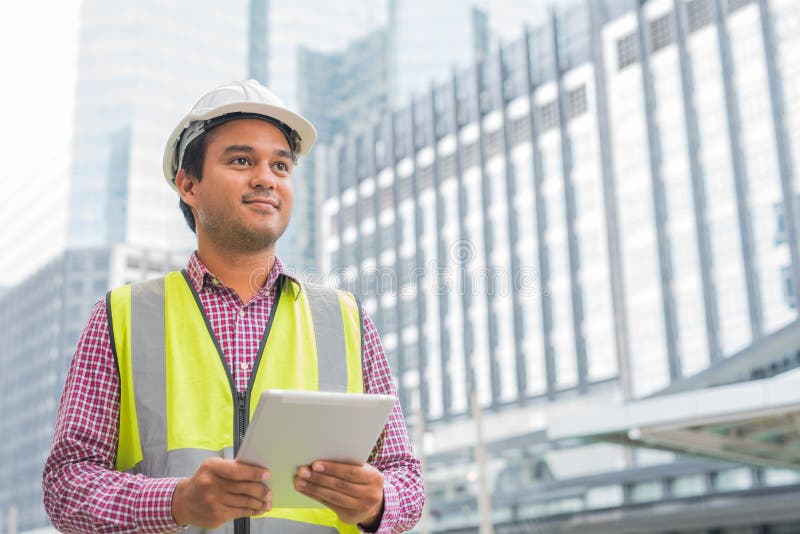 Asian Civil Engineer Working at Building Site. Stock Photo - Image of ...