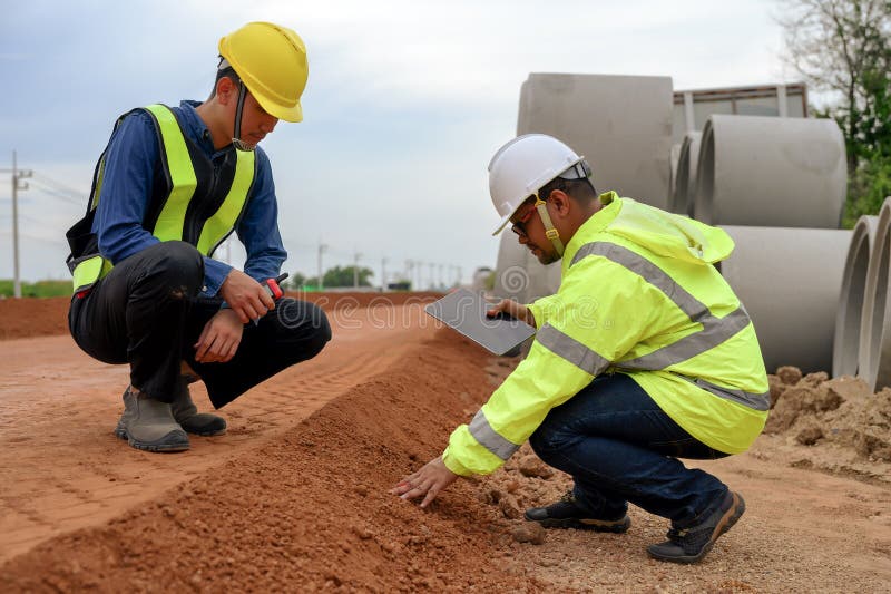 Asian Civil Engineers Consider and Discuss with Construction Foremen ...