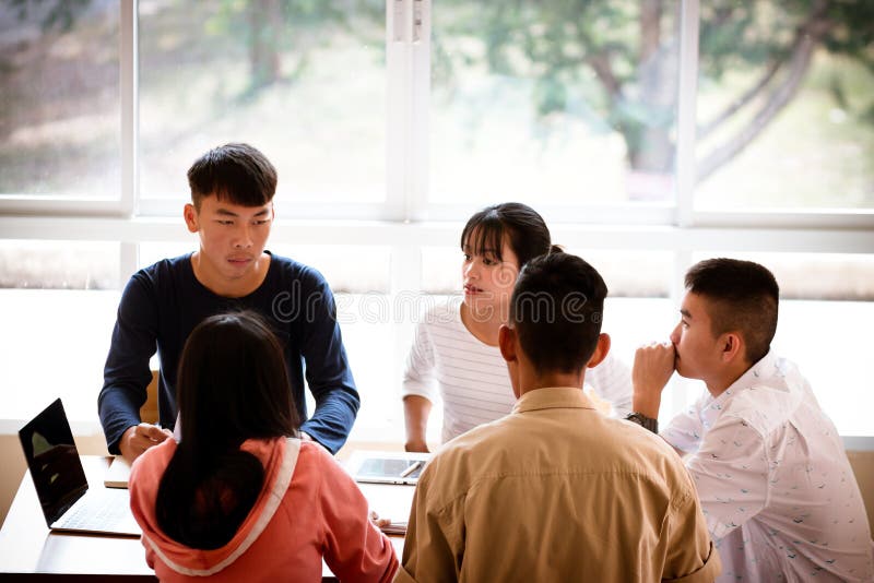 Asian College Groups of Students Using Laptop, Tablet, Studying ...
