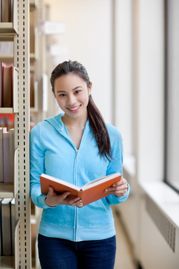Asian college student stock photo. Image of bookshelves - 19448976