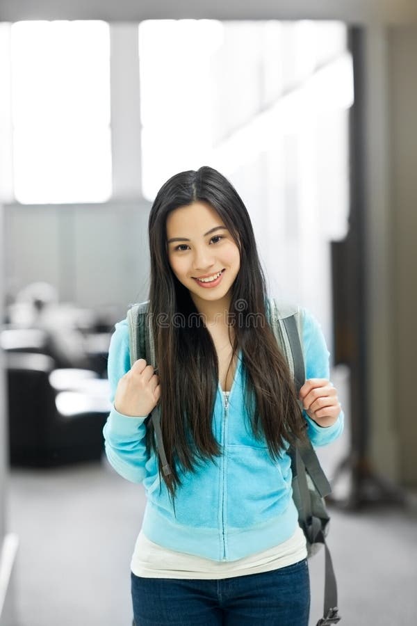 Asian college student stock photo. Image of bookshelves - 19448976