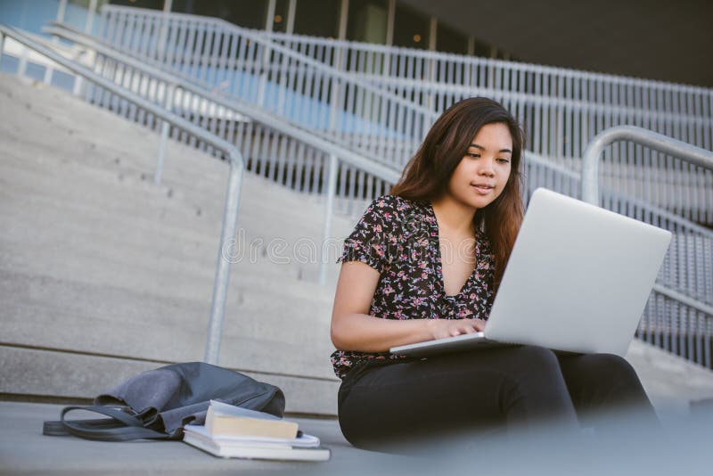 Asian College Student Using a Laptop in Some Campus Stairs Stock Image ...