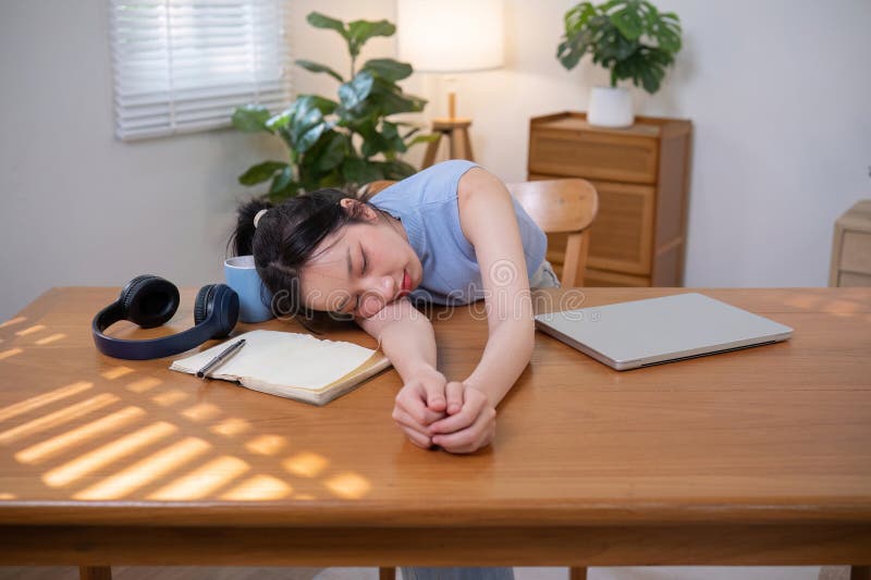 Asian College Student Who is Bored Sitting in Front of a Laptop ...