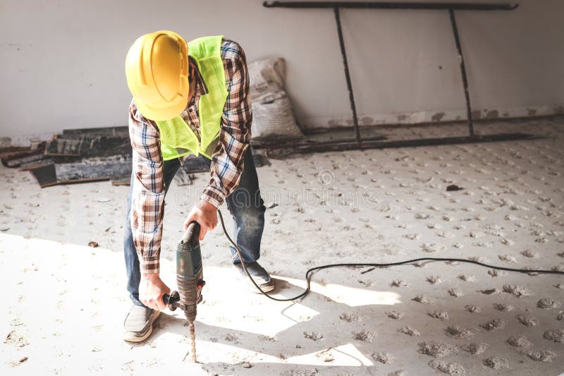 Asian Construction Worker Using Mortar Extraction Machine To Drill ...