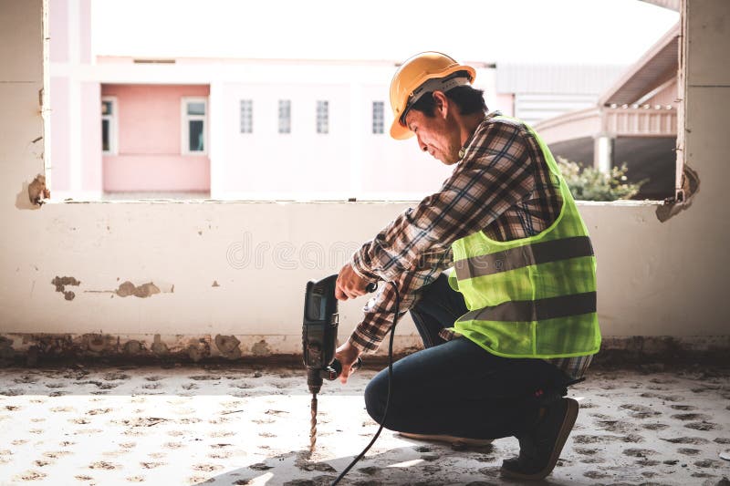 Asian Construction Worker Using Mortar Extraction Machine To Drill ...