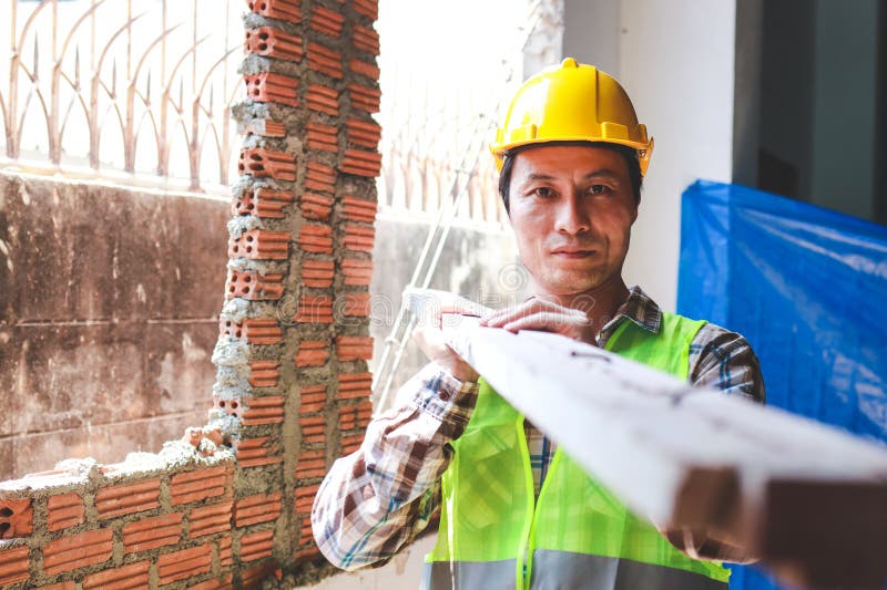 Asian Construction Worker in Yellow Helmet Stock Photo - Image of ...