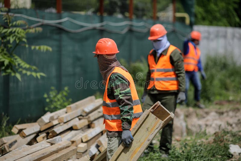Asian Construction Workers on a Construction Site in Bucharest ...