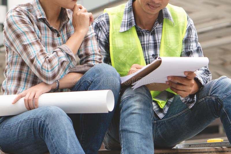 Contractor and Engineer Inspecting Material in Construction Building ...