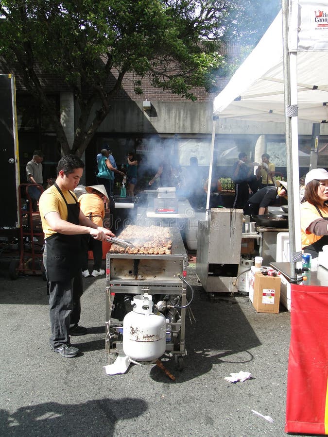 Asian Cooks Serving Food at Concessions Editorial Photo - Image of ...