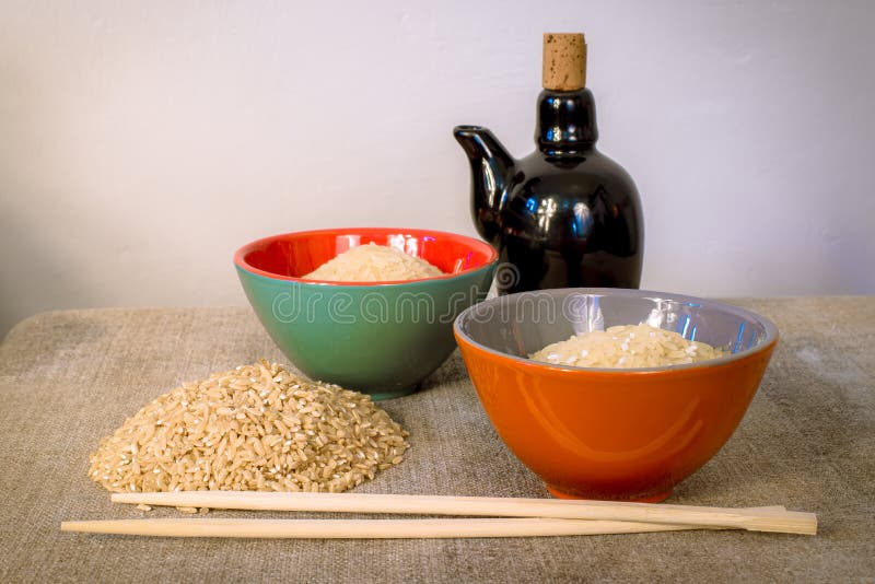 Asian Cuisine. Rice in Plates, a Bottle of Sake Stock Image - Image of ...