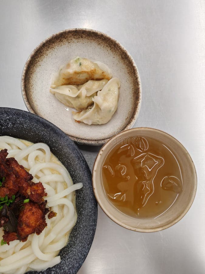 Asian Cuisine: Udon, Dumplings, and Iced Tea Stock Photo - Image of ...