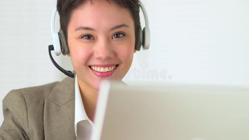Asian Customer Service Representative with Headset in Call Center Stock ...