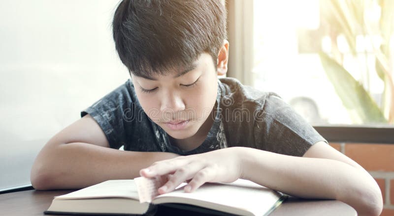 Asian Cute Boy Read Books in the Cafe Stock Image - Image of library ...