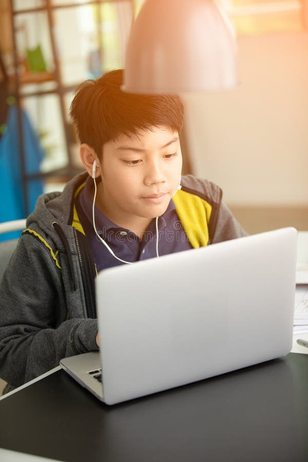 Asian Cute Boy Using Laptop Computer. Stock Photo - Image of person ...