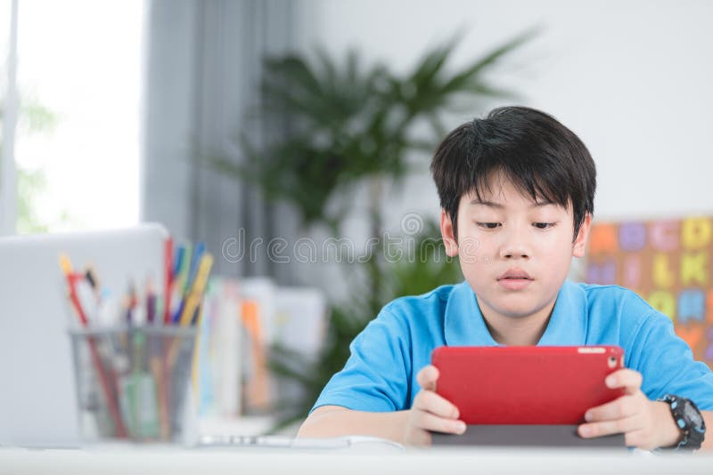 Asian Cute Boy Using Tablet Computer. Stock Image - Image of schoolboy ...