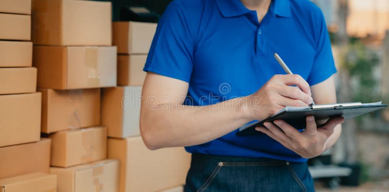 Asian Delivery Man in Cargo Van Checking Boxes Stock Image - Image of ...