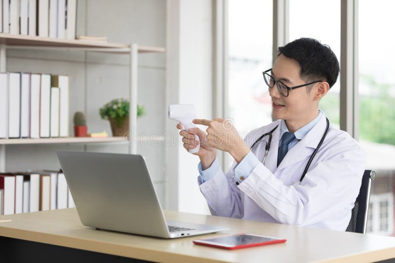 Doctor Present and Talking about Scan Head Thermometer with Patient or ...