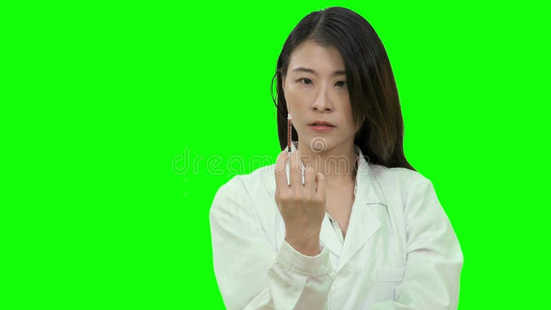 Asian Female Doctor Squeezing Syringe on Green Screen Stock Video ...