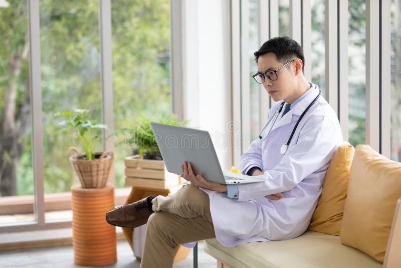 Doctor Using Laptop Computer and Thinking Something Stock Photo - Image ...