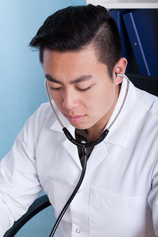 Asian Doctor during Working with Stethoscope Stock Image - Image of ...
