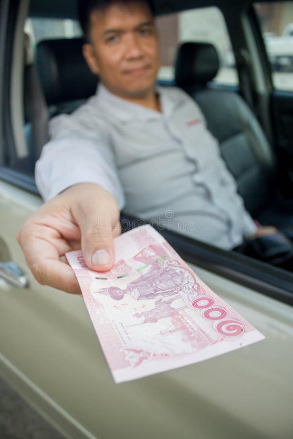 Asian driver sending money stock photo. Image of money - 70224132