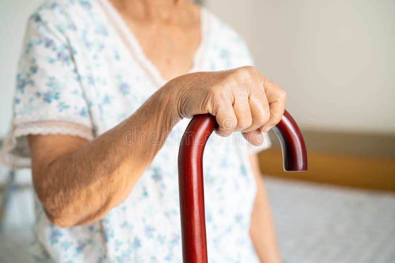 Asian Elderly Disability Woman Holding Waling Stick Wood Cane Round