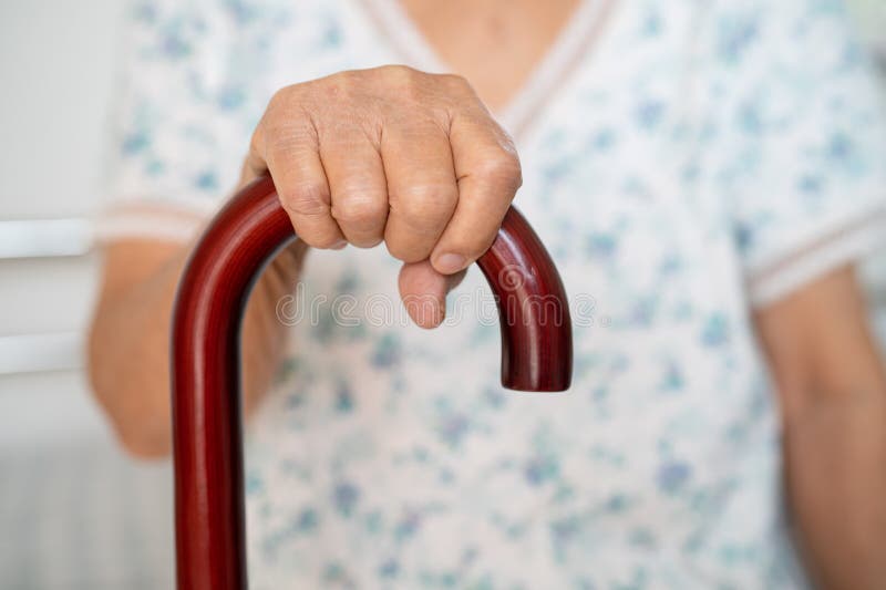 Asian Elderly Disability Woman Holding Waling Stick Wood Cane Round