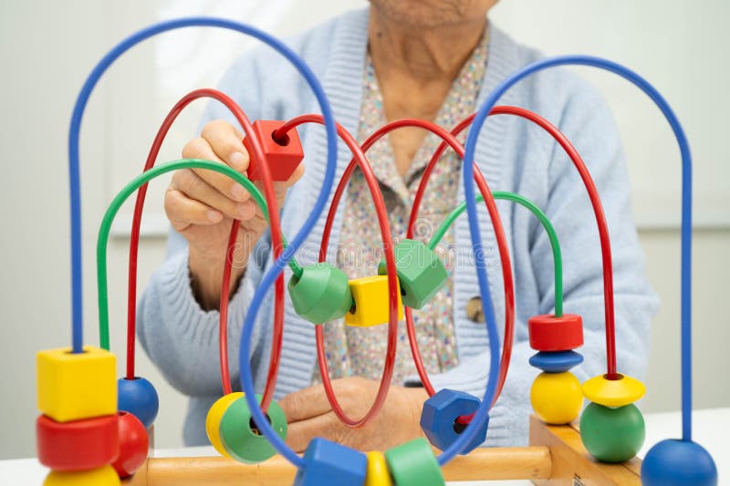 Asian Elderly Woman Playing Enhancing Skill Board Game Stock Photo ...