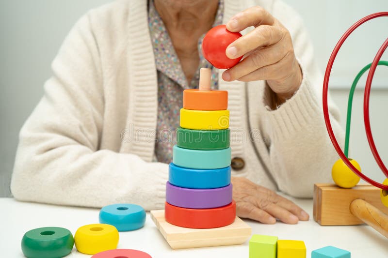 Asian Elderly Woman Playing Enhancing Skill Board Game Stock Image ...