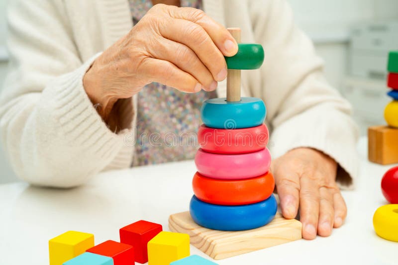 Asian Elderly Woman Playing Enhancing Skill Board Game Stock Photo ...