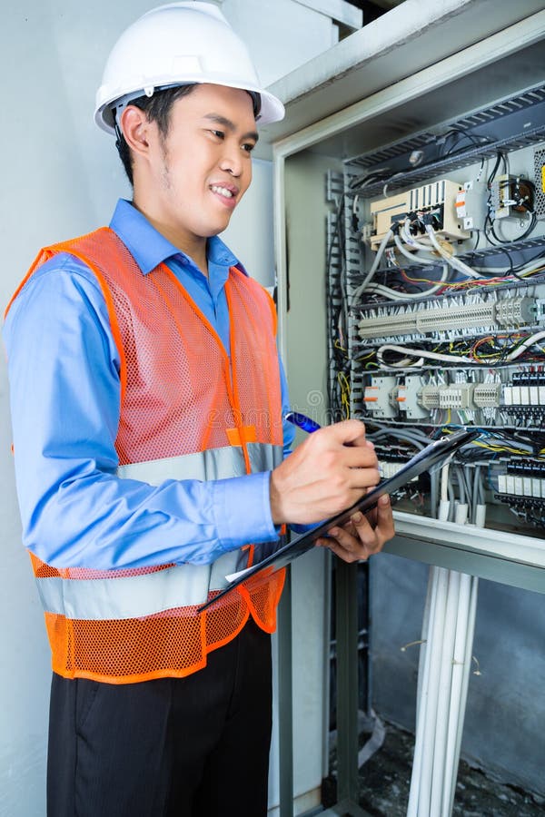 Asian Electrician At Panel On Construction Site Stock Photo - Image of ...