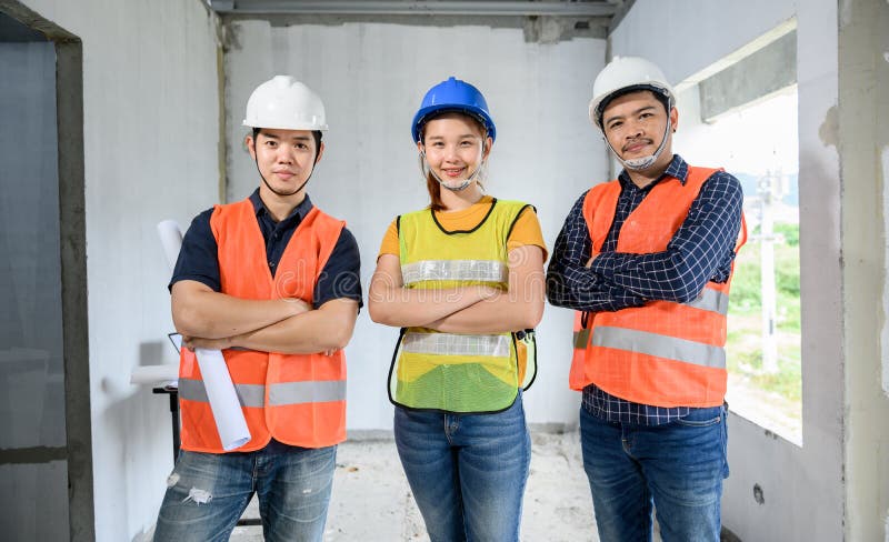Asian Engineer and Architect Smiling Group at Construction Property ...