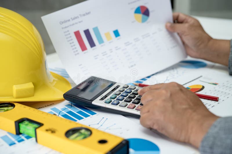 Asian Engineer with Architectural House Plan Project Blueprint, Graph ...