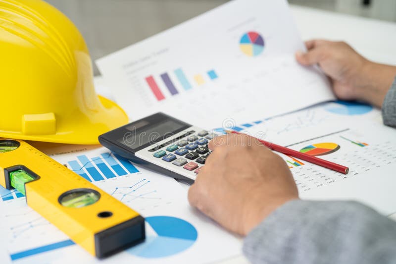 Asian Engineer with Architectural House Plan Project Blueprint, Graph ...