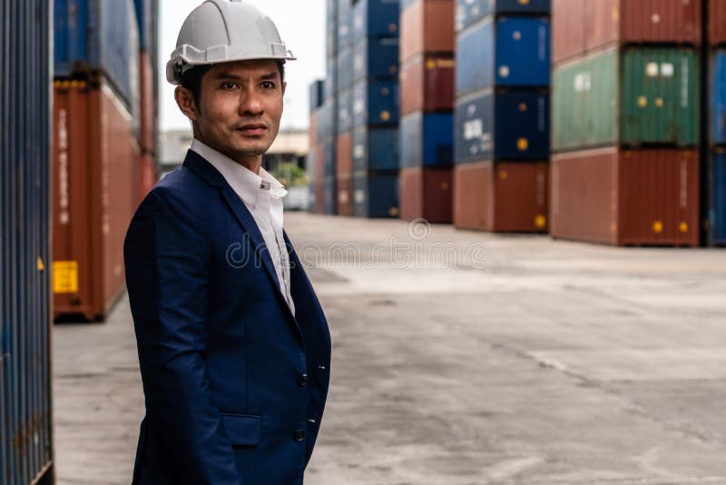 Asian Engineer in Blue Suit Wearing Safety Helmet Standing in Shipyard ...