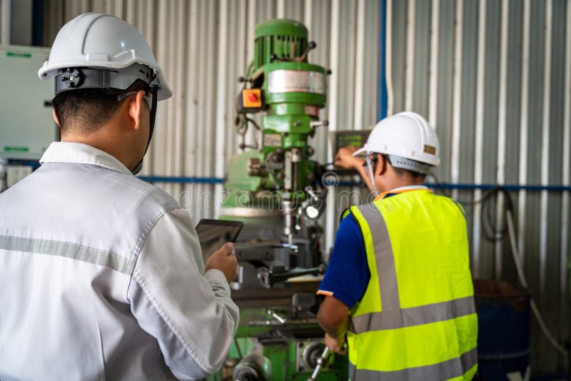 Asian Engineer Checking Worker Operating Lathe Grinding Machine ...