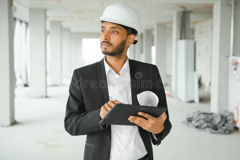 Architect at a Construction Site with Blueprints Stock Photo - Image of ...